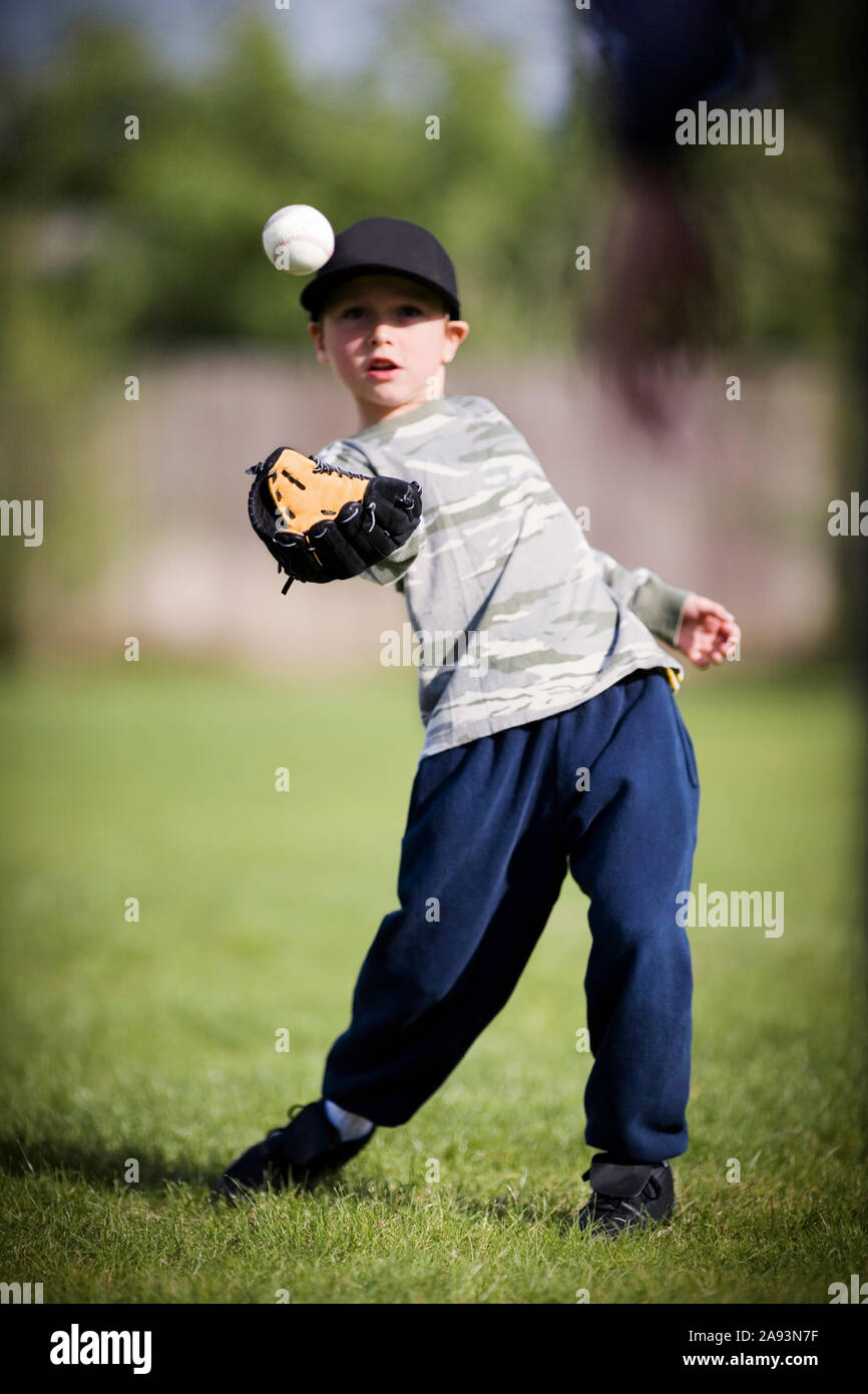 Young boy playing baseball Stock Photo - Alamy