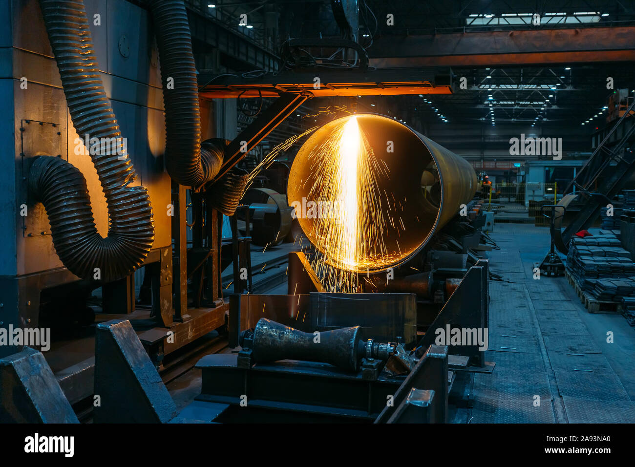 Plasma cutting machine with CNC cutting steel pipe with sparks Stock ...