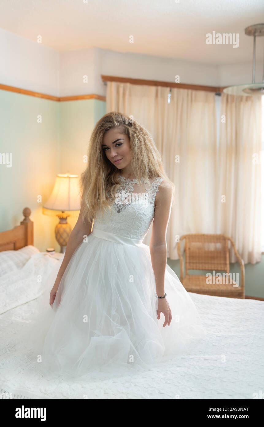 Young bride gets ready - morning sun and wedding day morning Stock ...