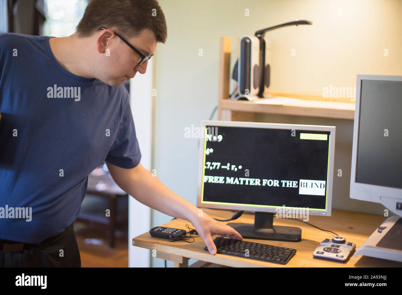 Man with Visual Impairment using his computer Stock Photo - Alamy