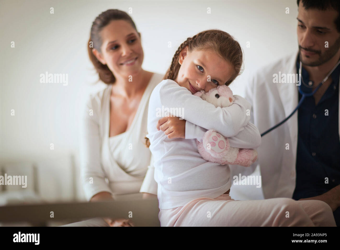 Young girl getting a checkup at the doctor's office Stock Photo - Alamy