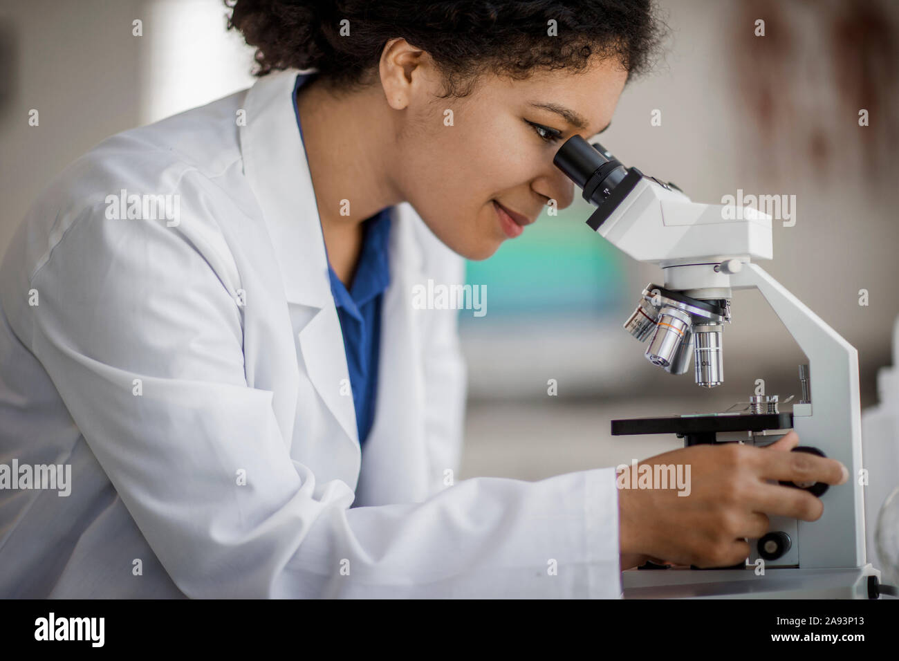 Scientist using a microscope Stock Photo - Alamy