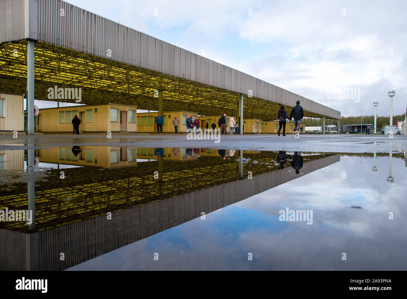 Marienborn, Germany. 09th Nov, 2019. Visitors pass buildings of the car ...