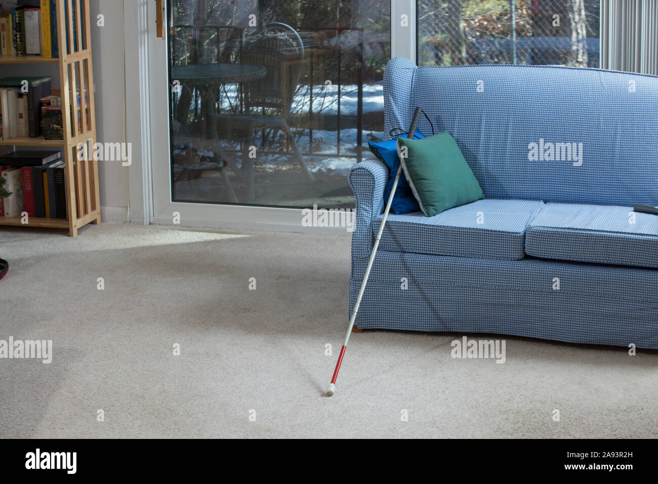 Cane leaning against sofa Stock Photo - Alamy