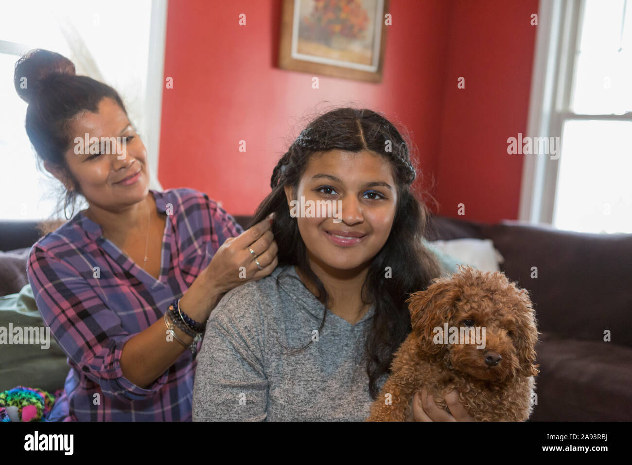 Mother doing the hair of her teen with Autism Stock Photo - Alamy