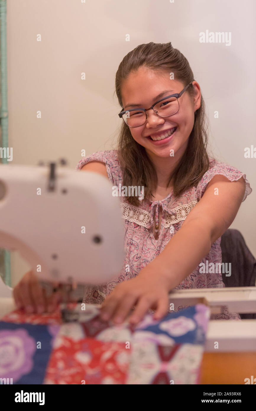 Teenage girl who has Learning Disability sewing clothes Stock Photo - Alamy