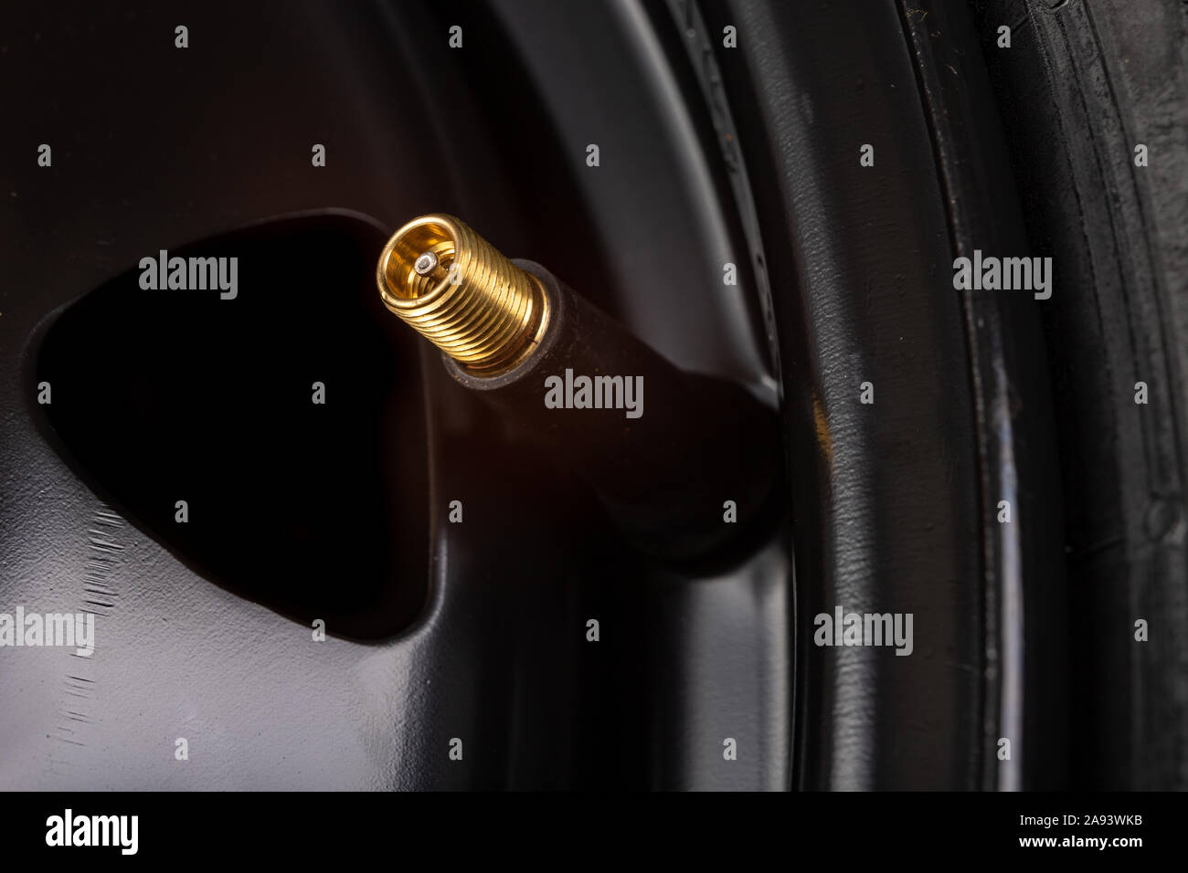 Vent in the wheel of a passenger car. A place to refill air with tires ...