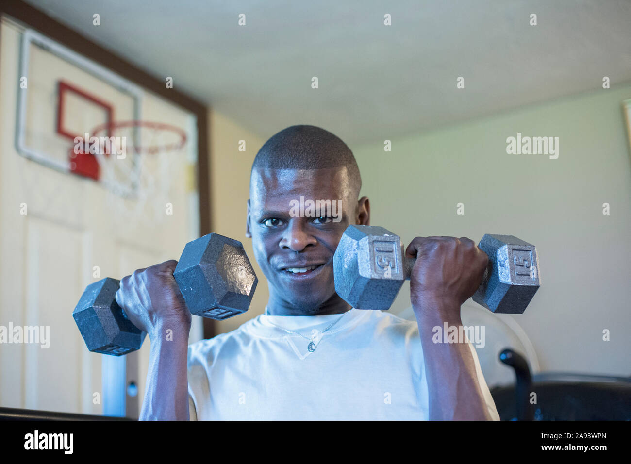 Man with Williams Syndrome exercising Stock Photo - Alamy