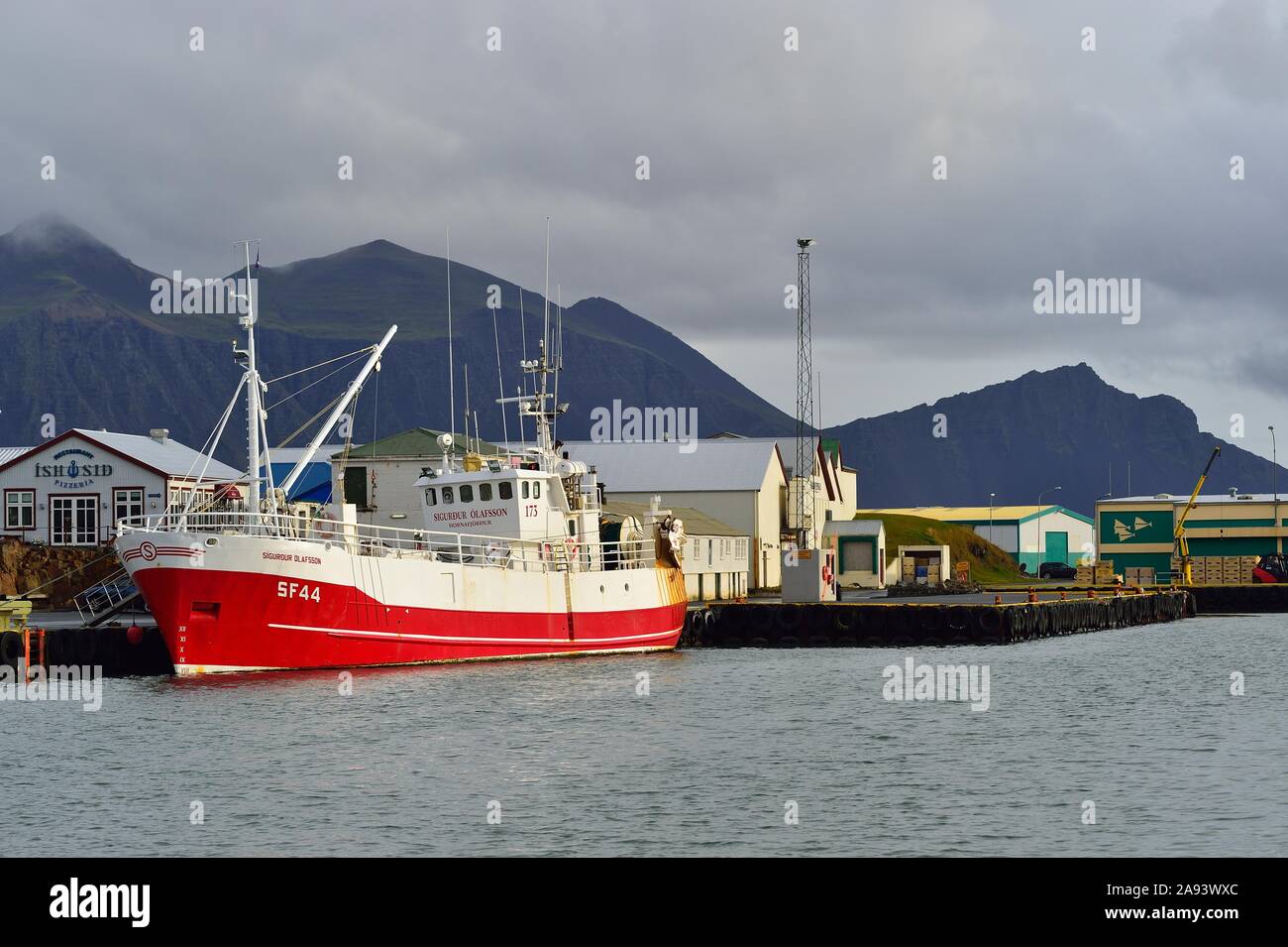 Hofn, Iceland. A freighter docked in the harbor of the coastal ...