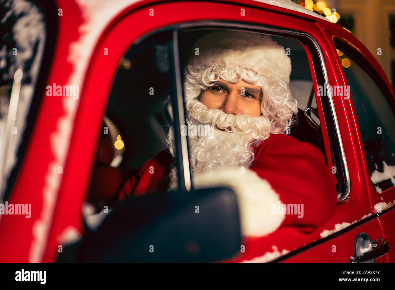 Portrait of Santa Claus. Santa Claus is driving his red car Stock Photo ...