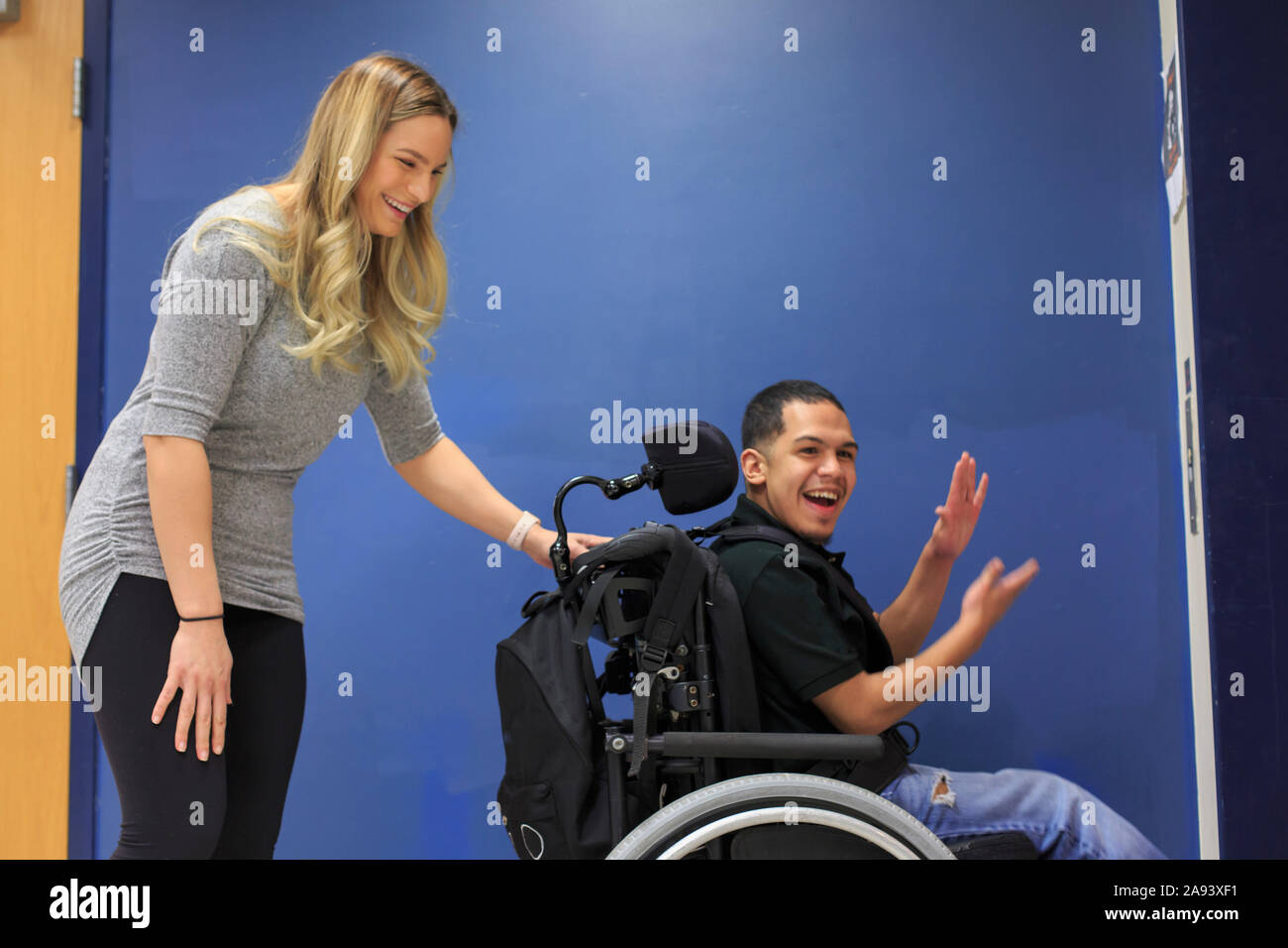 Boy with Spastic Quadriplegic Cerebral Palsy clapping with teacher at ...