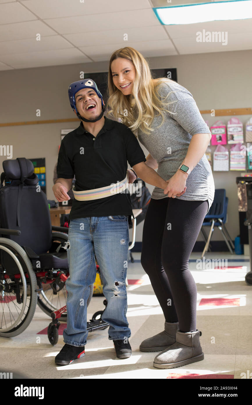Boy with Spastic Quadriplegic Cerebral Palsy and teacher at school ...
