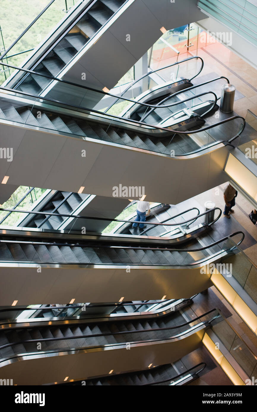Flights of escalators inside a multi-story building Stock Photo - Alamy