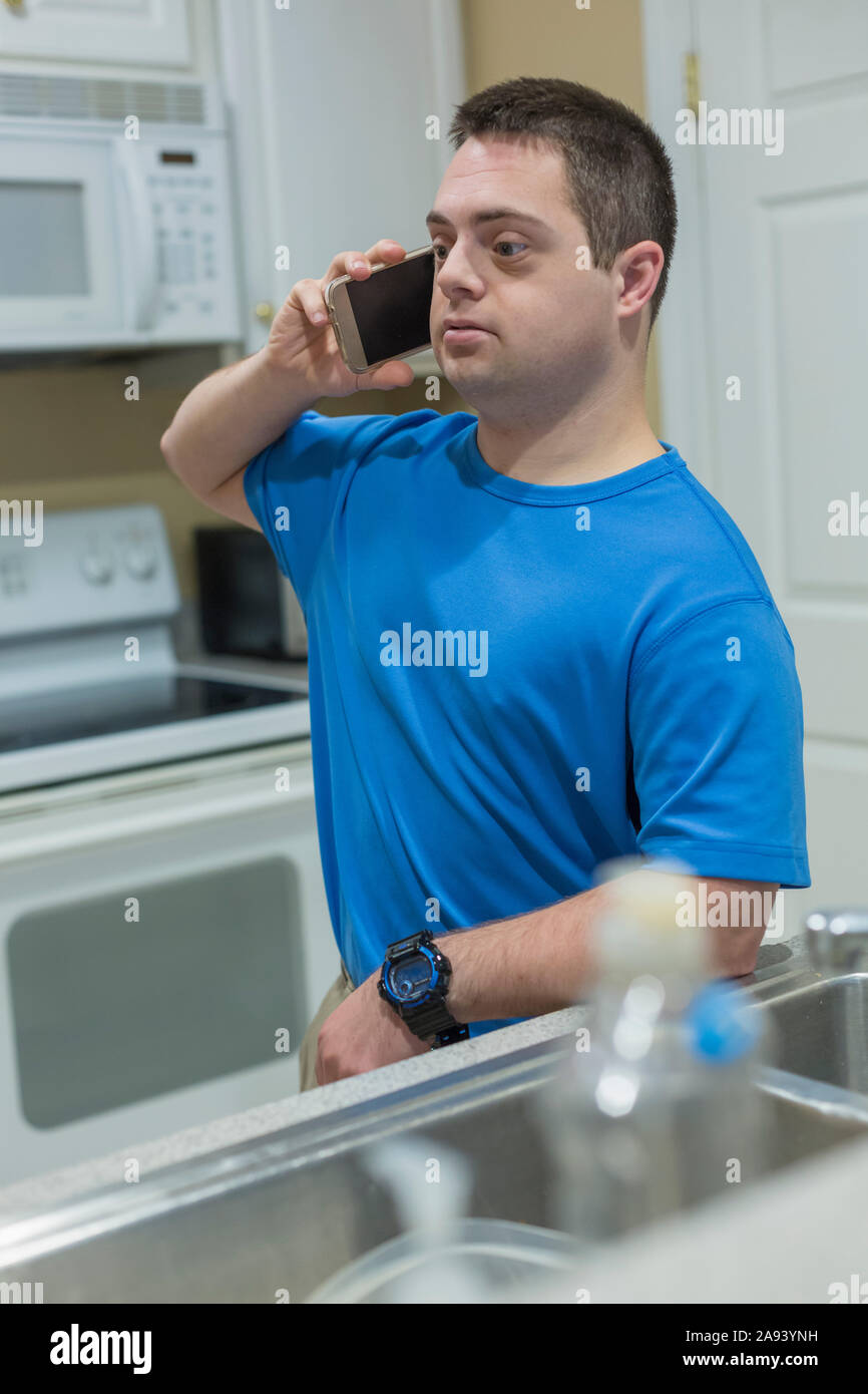 Standing looking down technology communication hi-res stock photography ...