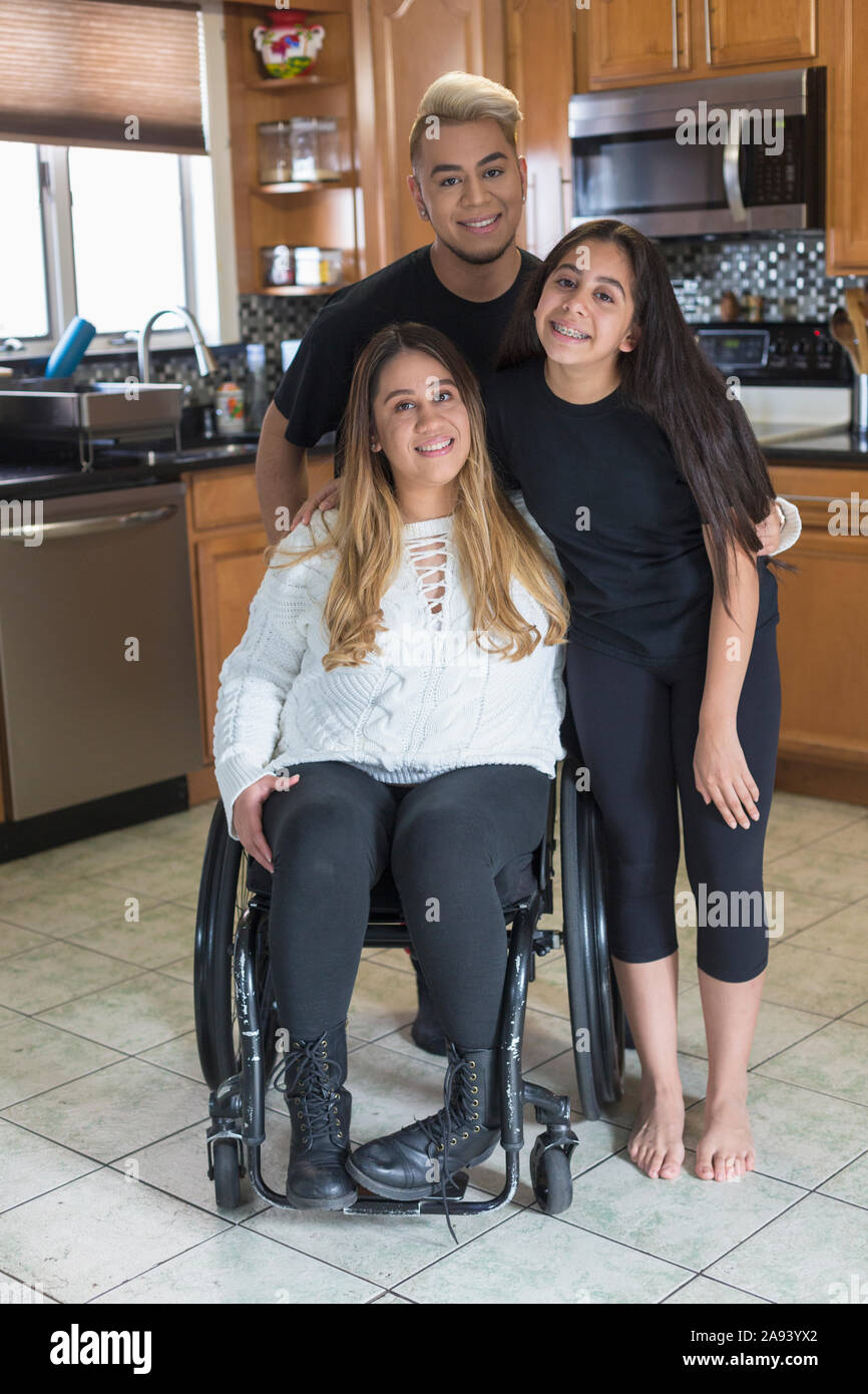 Woman who has Spinal Cord Injury standing with her friends in the ...