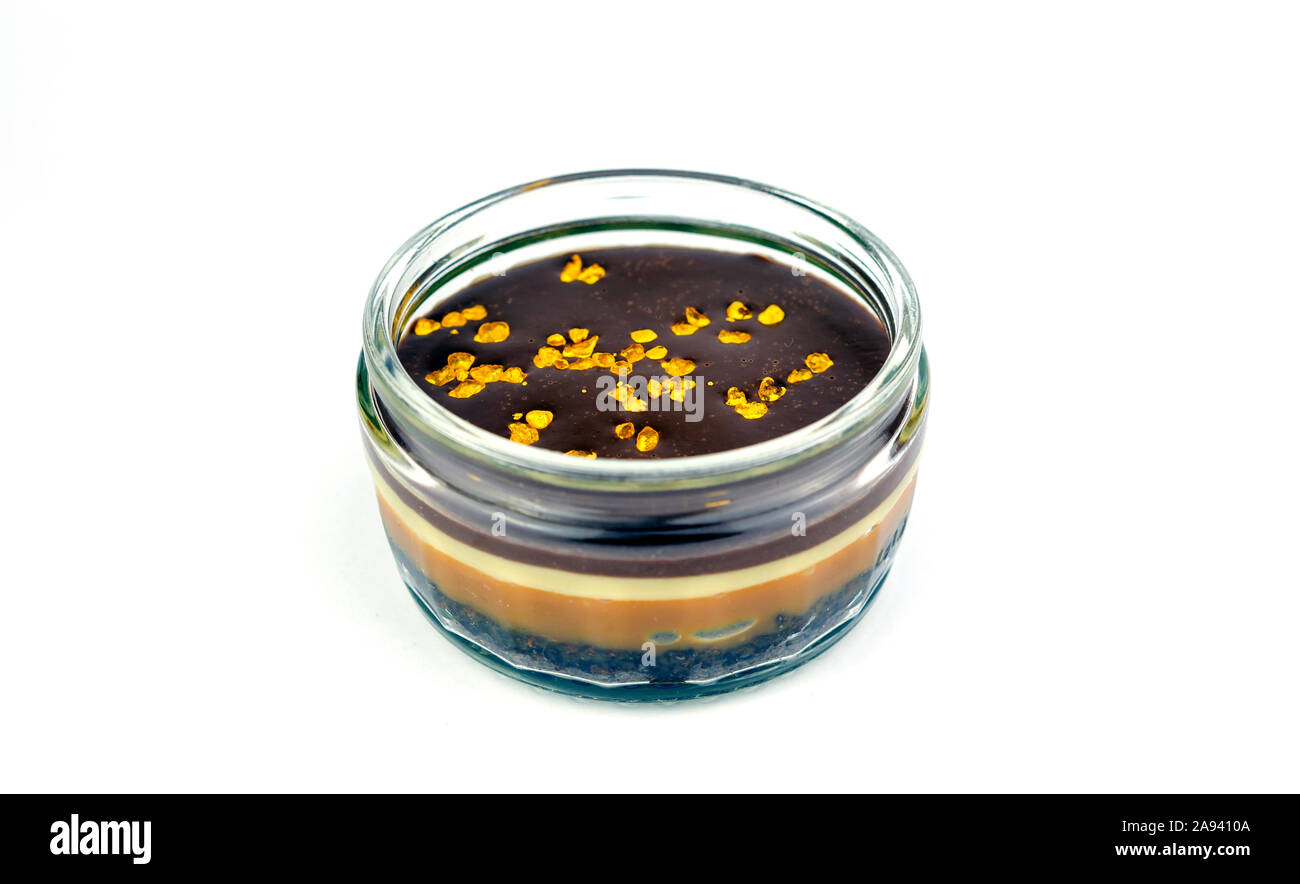 Real Gold flakes seen on the chocolate layered desert. Eatable gold ...