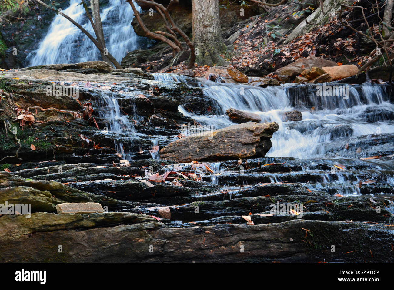 Water from Cascade Creek pours over the rocks at the Lower Cascades ...