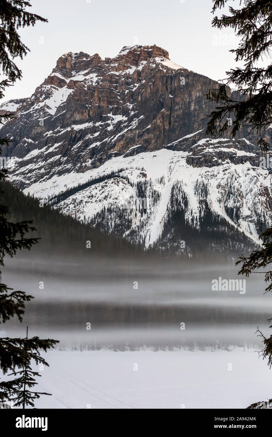 Evergreen trees reflecting lake hi-res stock photography and images - Alamy