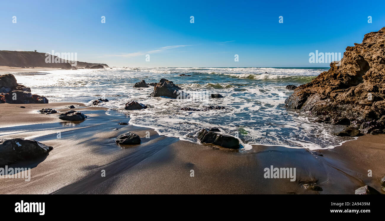 Surf washes up on the beach along the Oregon Coast; Oregon, United ...