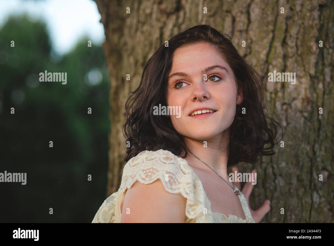 Teenager Leaning Against Tree High Resolution Stock Photography and ...