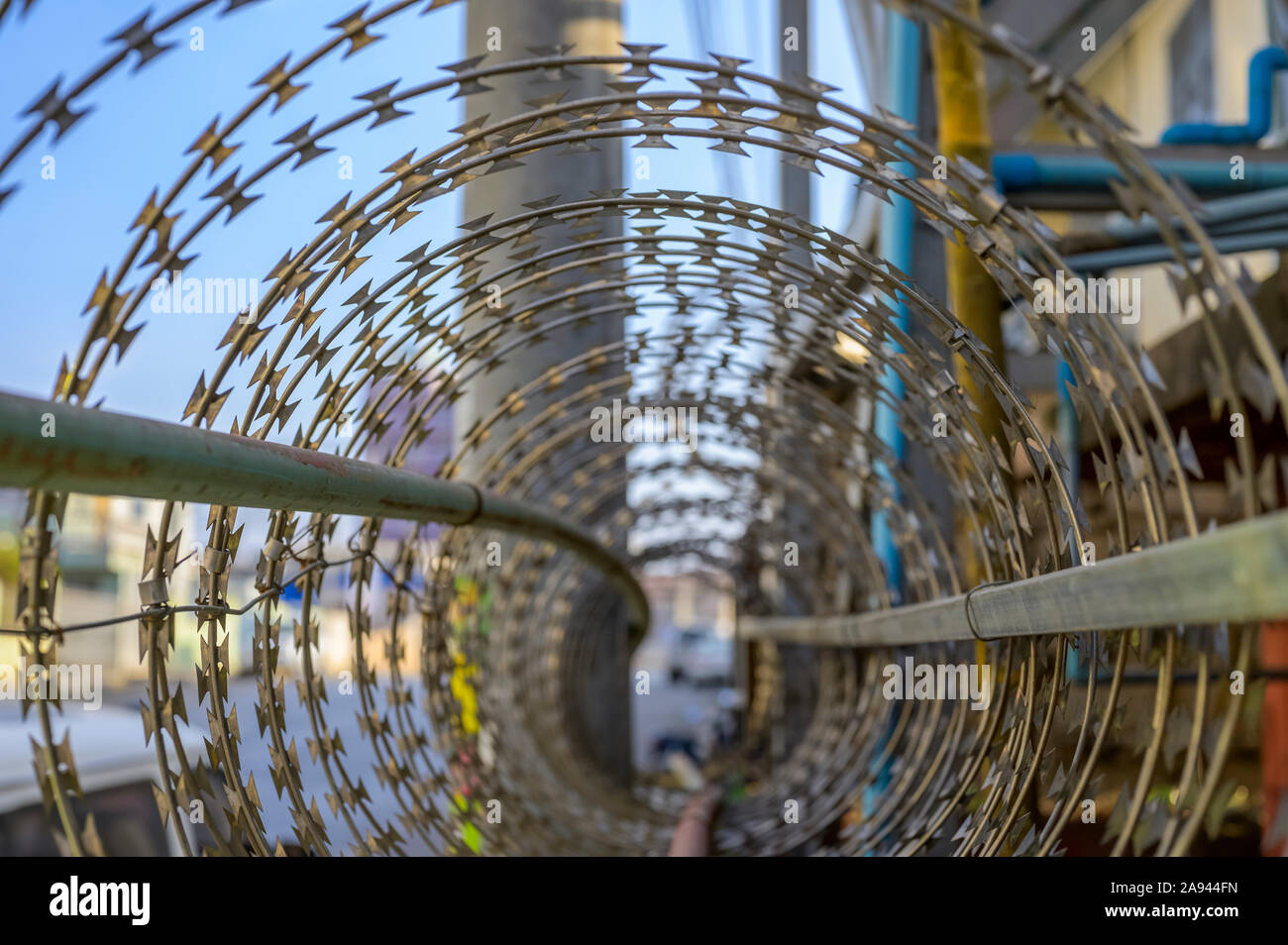 Sharp edges in a coiled razor wire; Taungyii, Shan State, Myanmar Stock ...