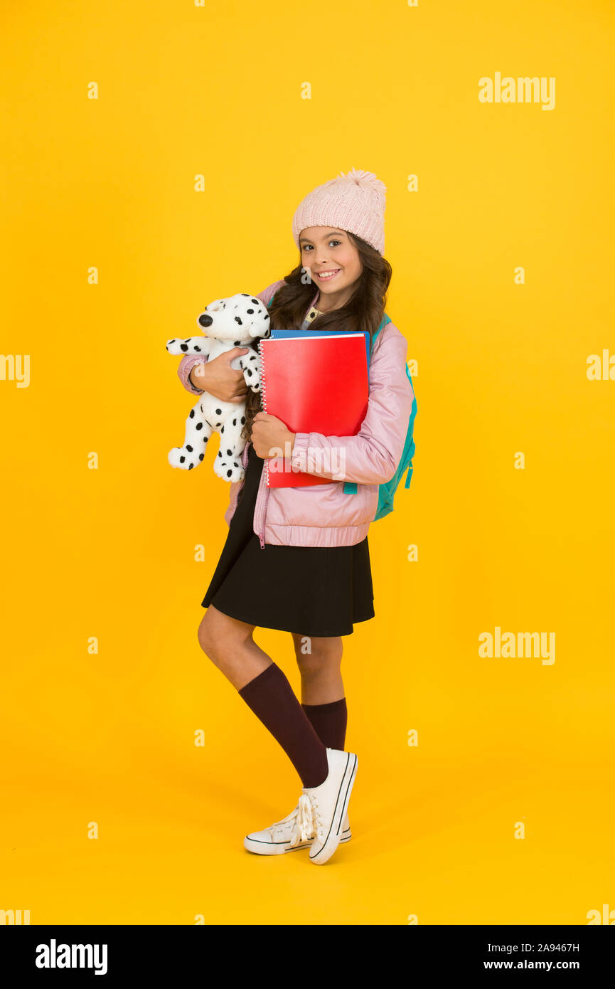 Having fun while learning. Small girl go to preschool with toy. Happy ...