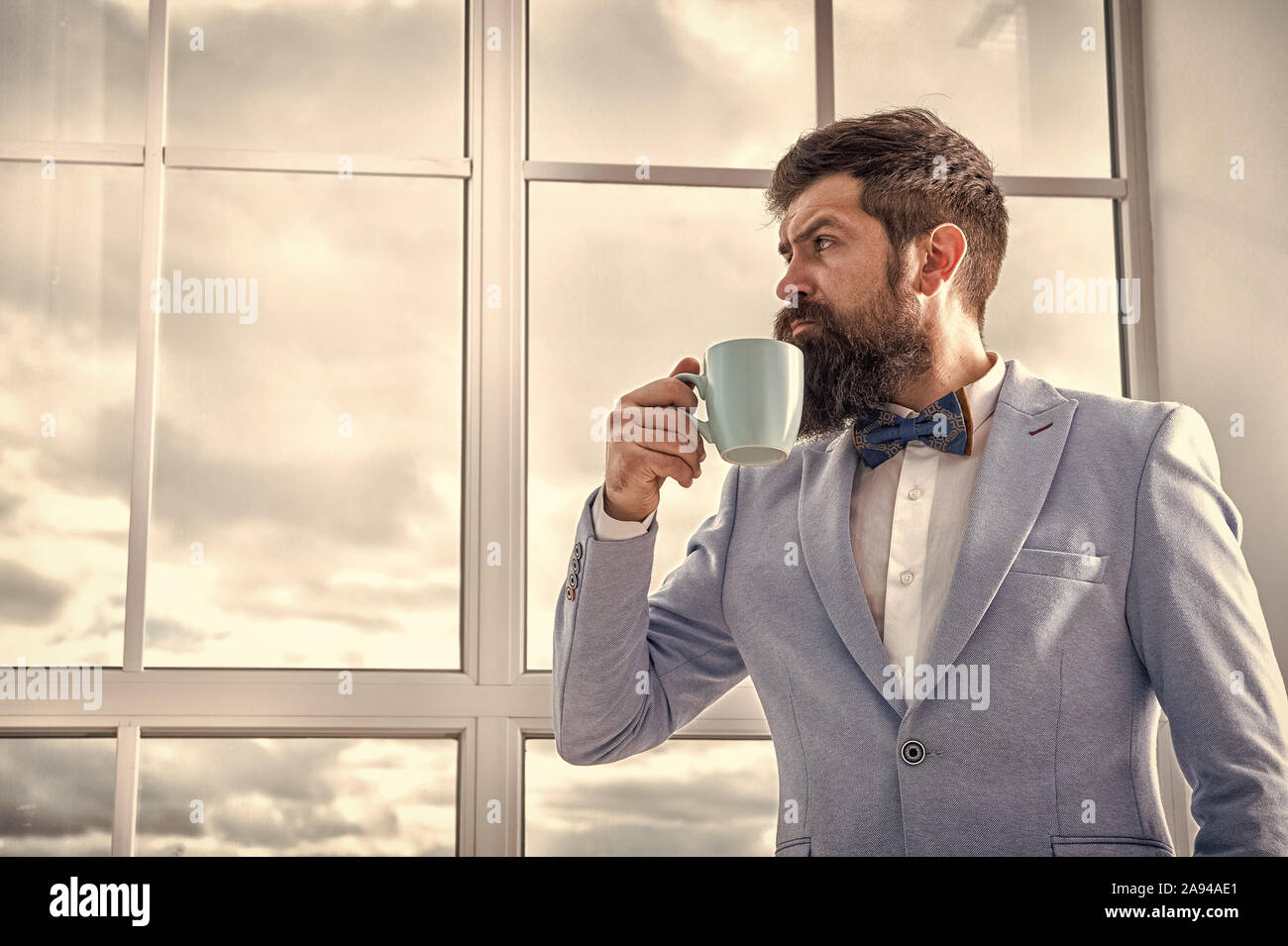 good morning coffee. serious bearded man drink coffee. businessman in ...