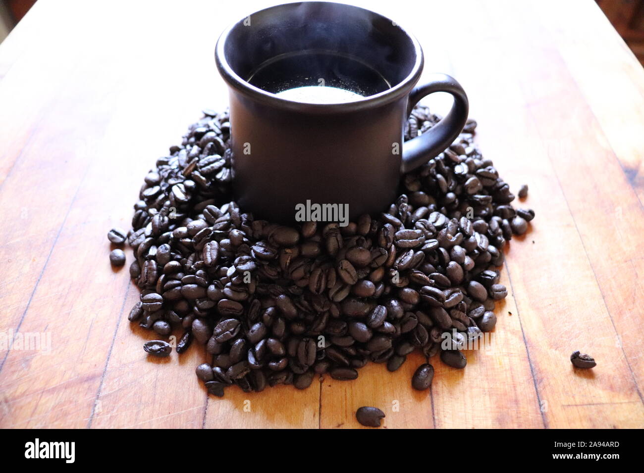 Cup of coffee surrounded by coffee beans hi-res stock photography and ...