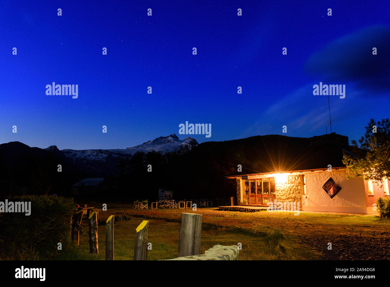 Club Andino Bariloche building against Mount Tronador on a clear starry ...
