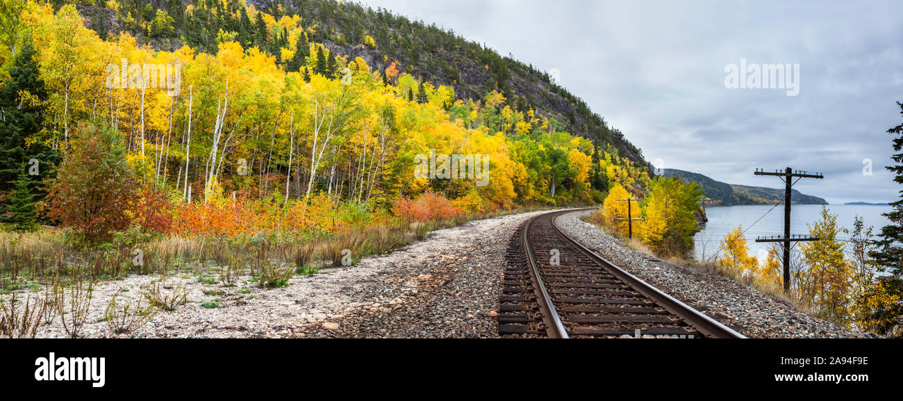 Train tracks along Lake Superior with tree in autumn coloured foliage ...