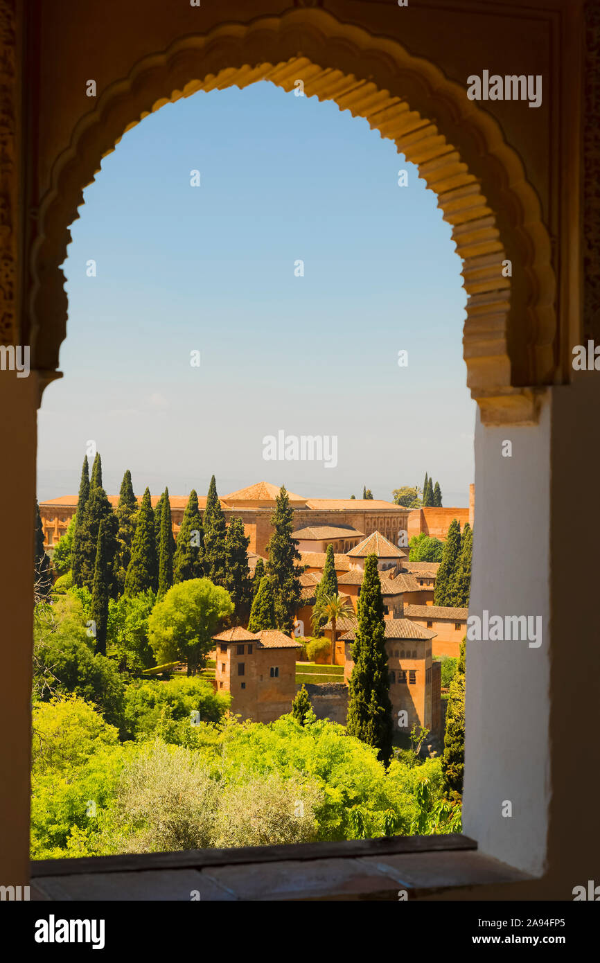 Arched window with a view from Alhambra; Granada, Andalusia, Spain ...