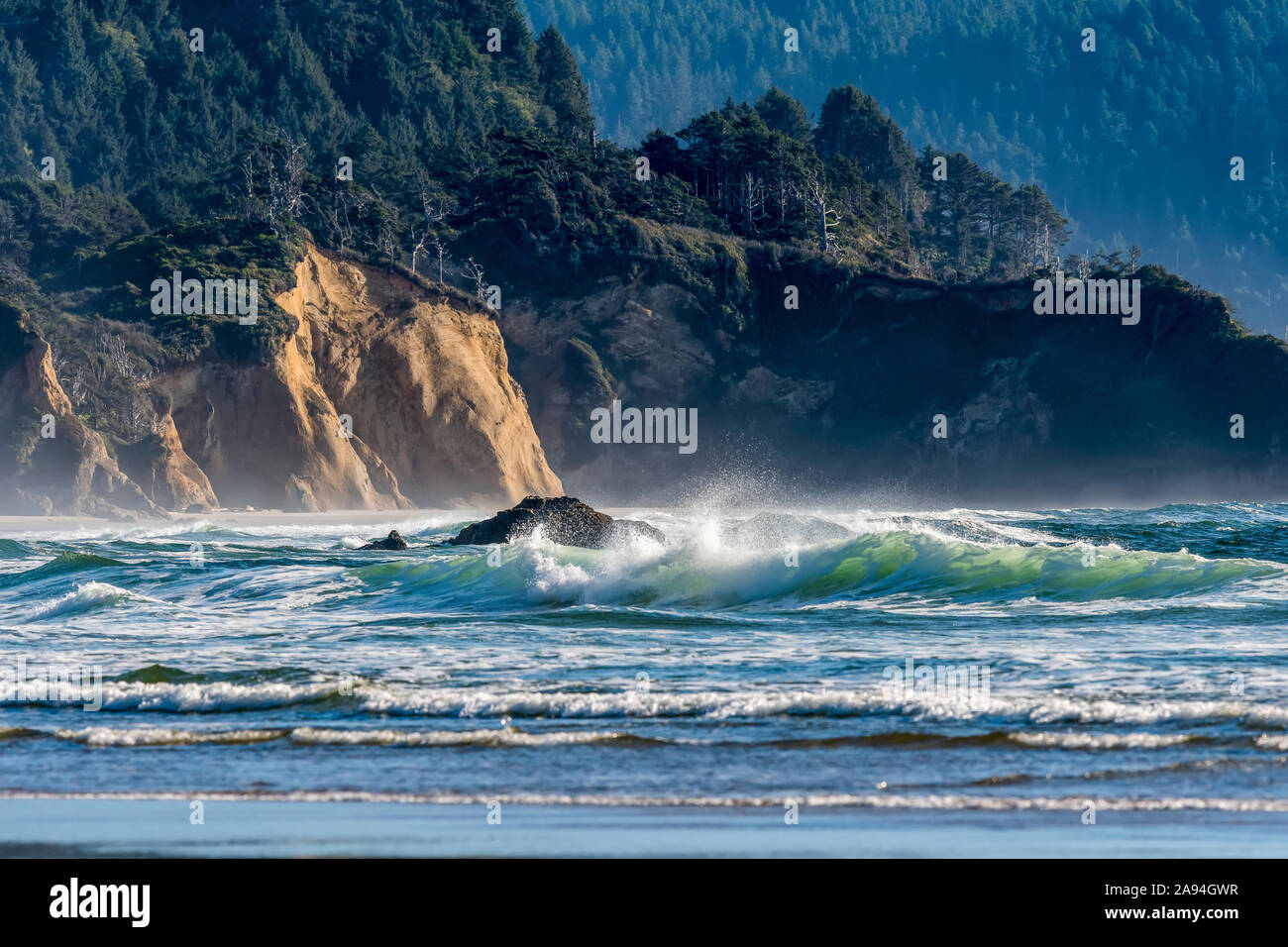 Surf catches the light near Hug Point on the Oregon Coast; Arch Cape ...
