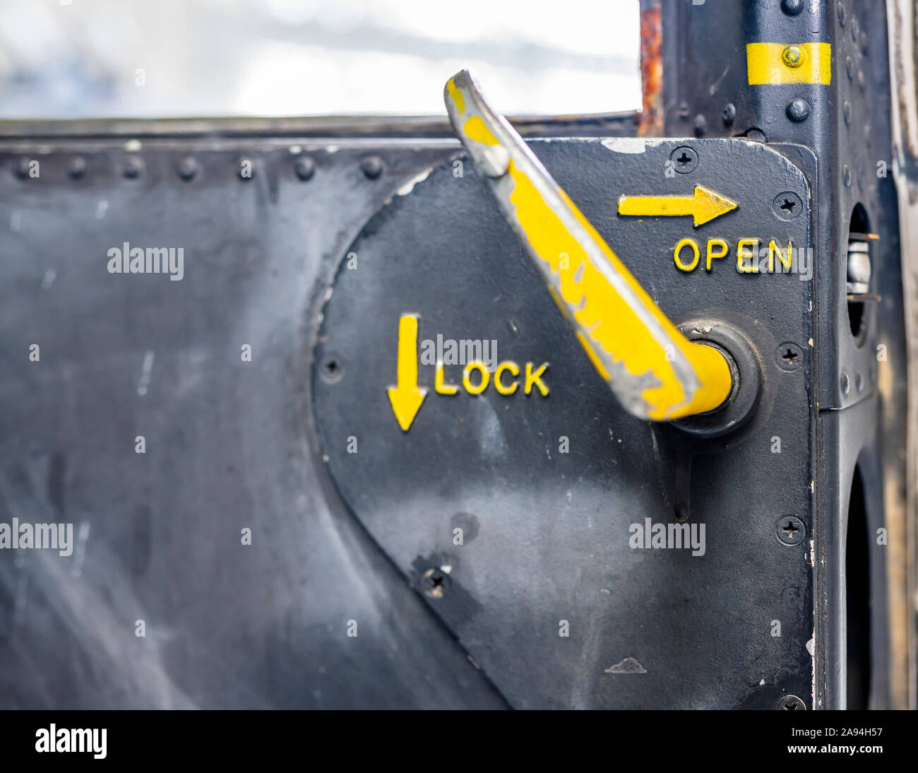 The yellow handle of the inner side of the door of the old helicopter ...