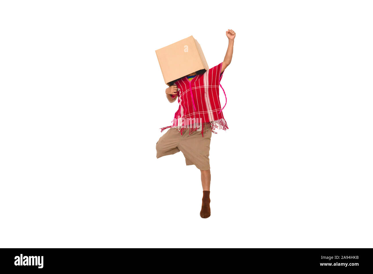 Young boy over isolated white background holding a box to move it to ...