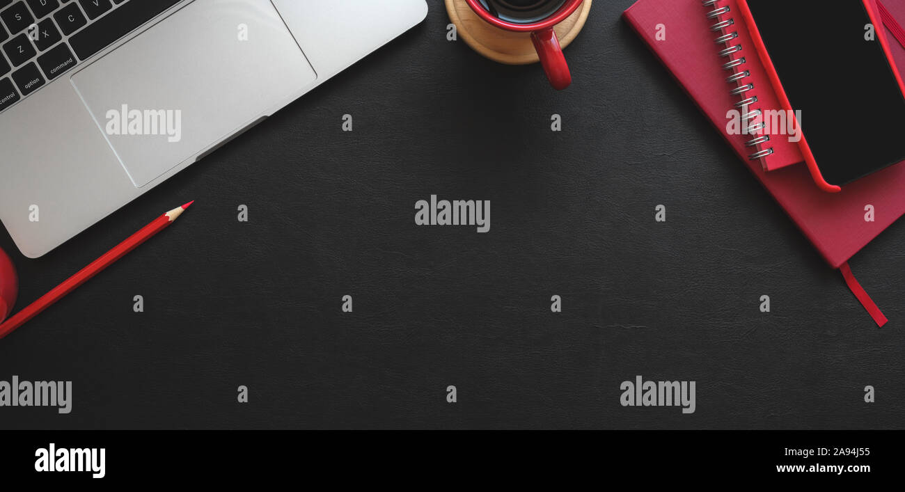 Top view of modern workplace with laptop computer and red office ...