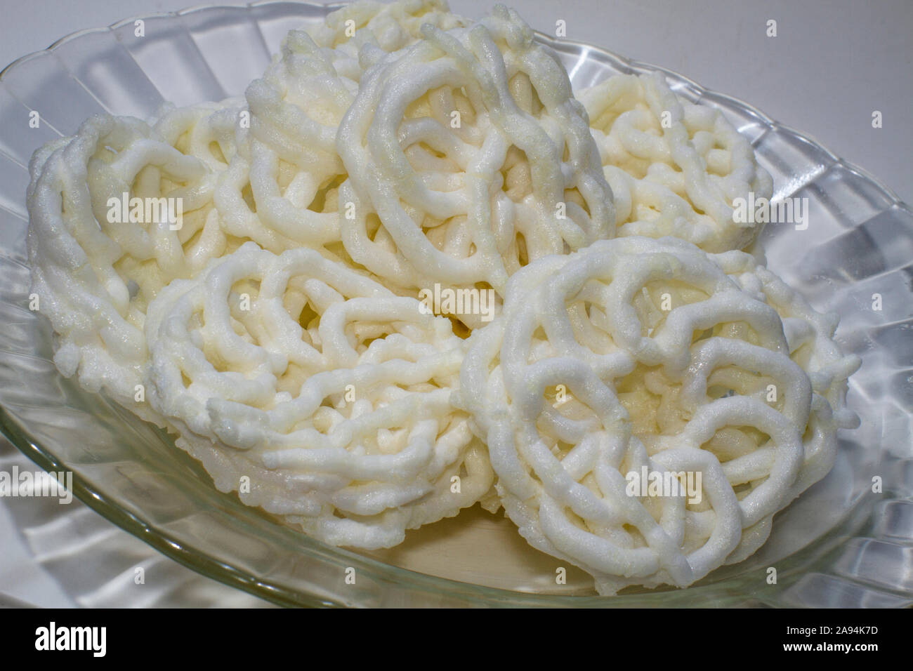 Traditional food crunchy white crackers serve on the plates Stock Photo ...