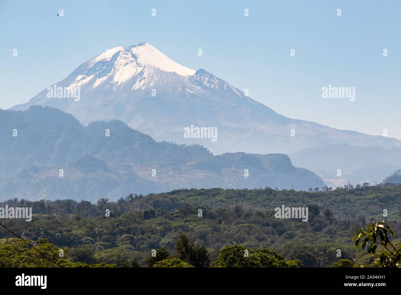 The snowcapped Cofre de Perote volcano dominates the jungle near Xico ...