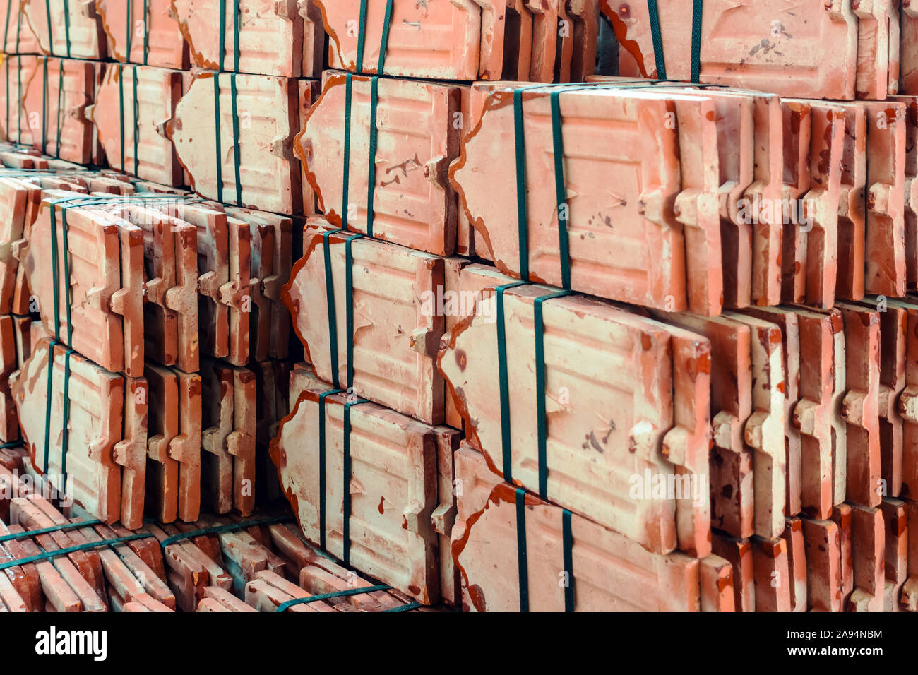 Close up to many pile of roof tiles traditional clay stack for a ...