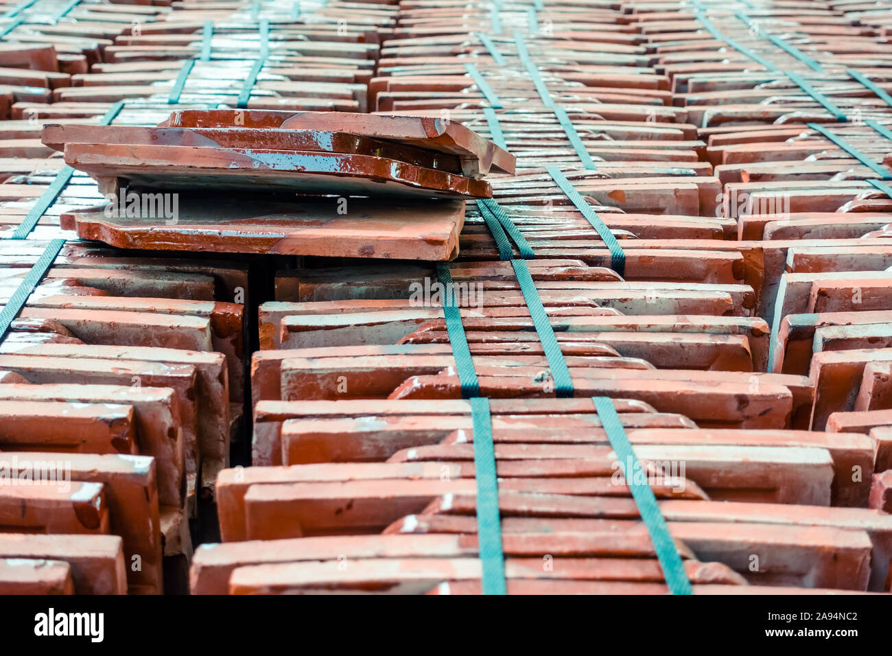 Close up to many pile of roof tiles traditional clay stack for a ...