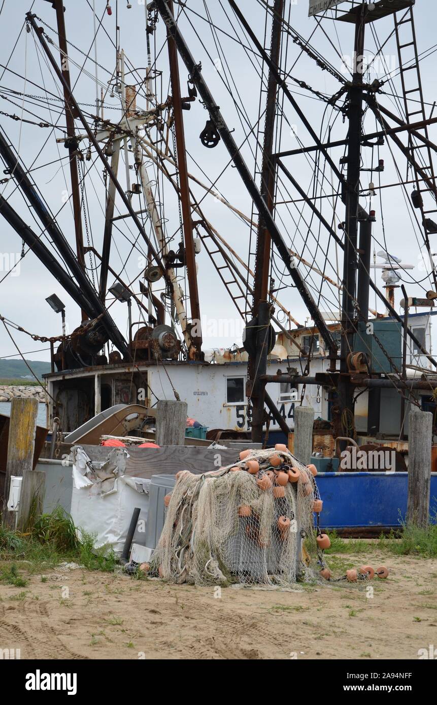 Collection of fishing nets and containers by commercial fishing boats ...