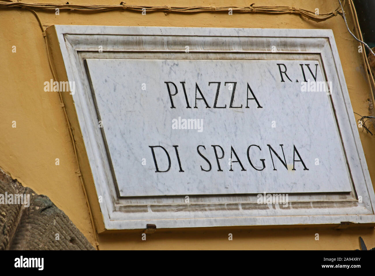 detail of a public street sign or name labelling Piazza di Spagna a ...
