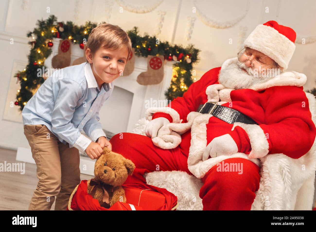 Santa Claus with kids indoors christmas celebration concept Stock Photo ...