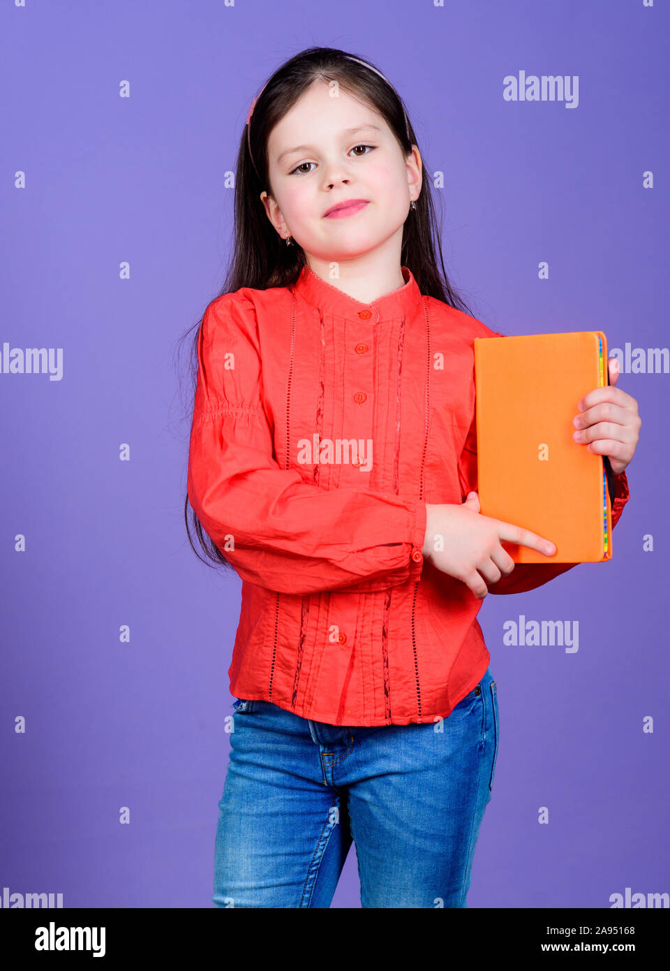 Girl hold book violet background. Kid show book. Book concept ...