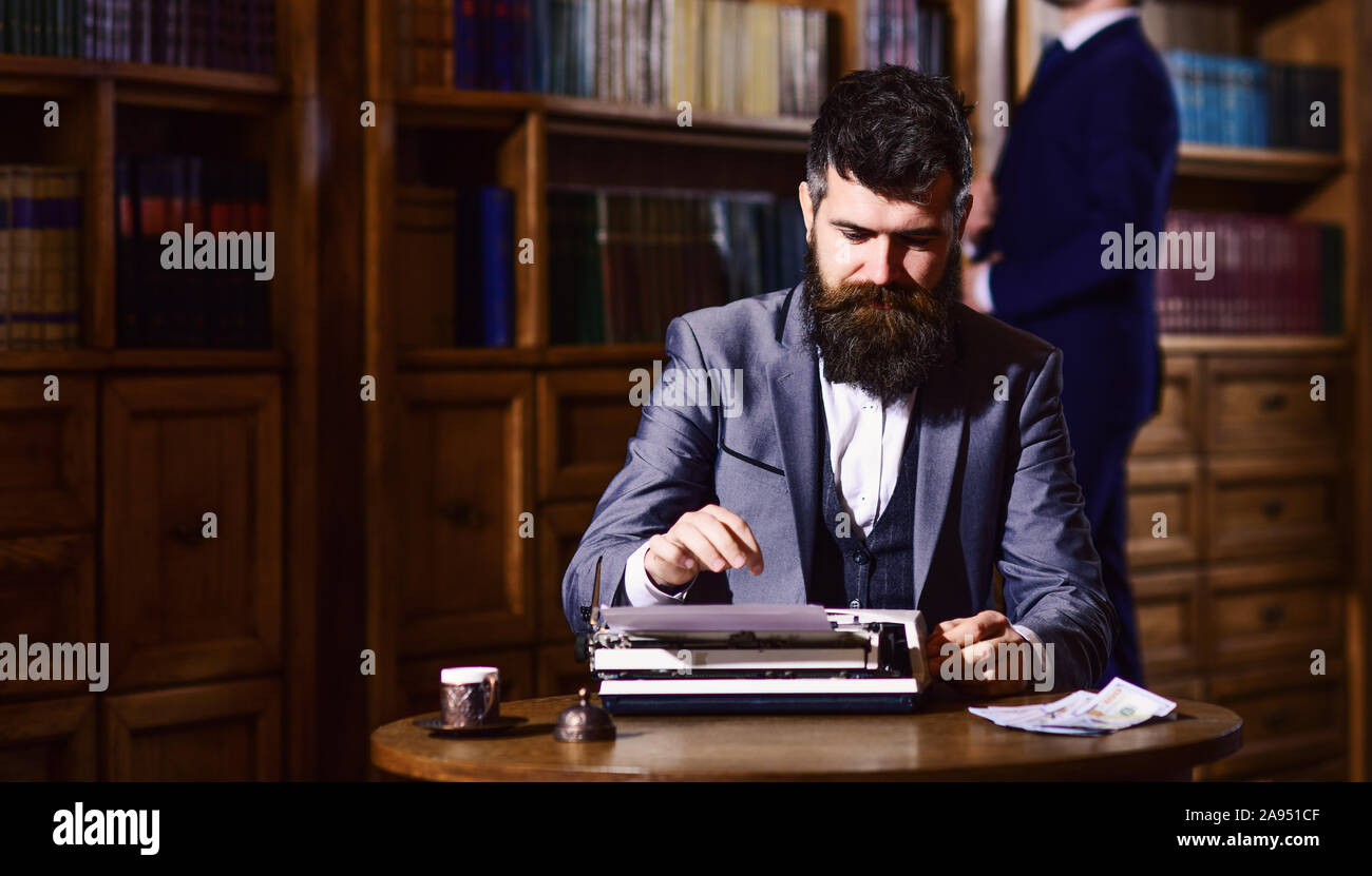 Writing and literature concept. Man with beard and busy face sit in ...