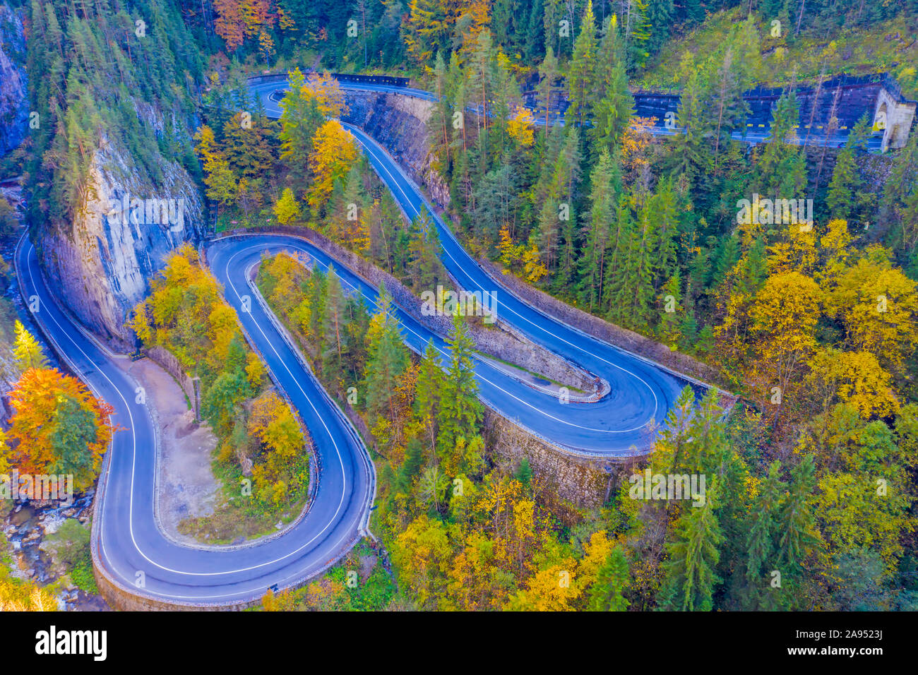 Uphill winding road in autumn mountain. Bicaz Gorges are a mountain ...