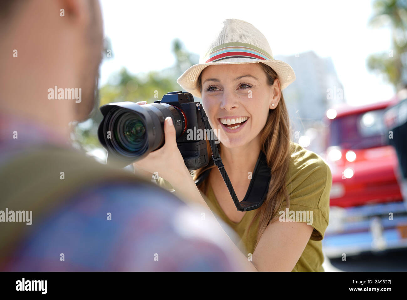 Woman photographer taking picture of model in the street of Miami Stock ...