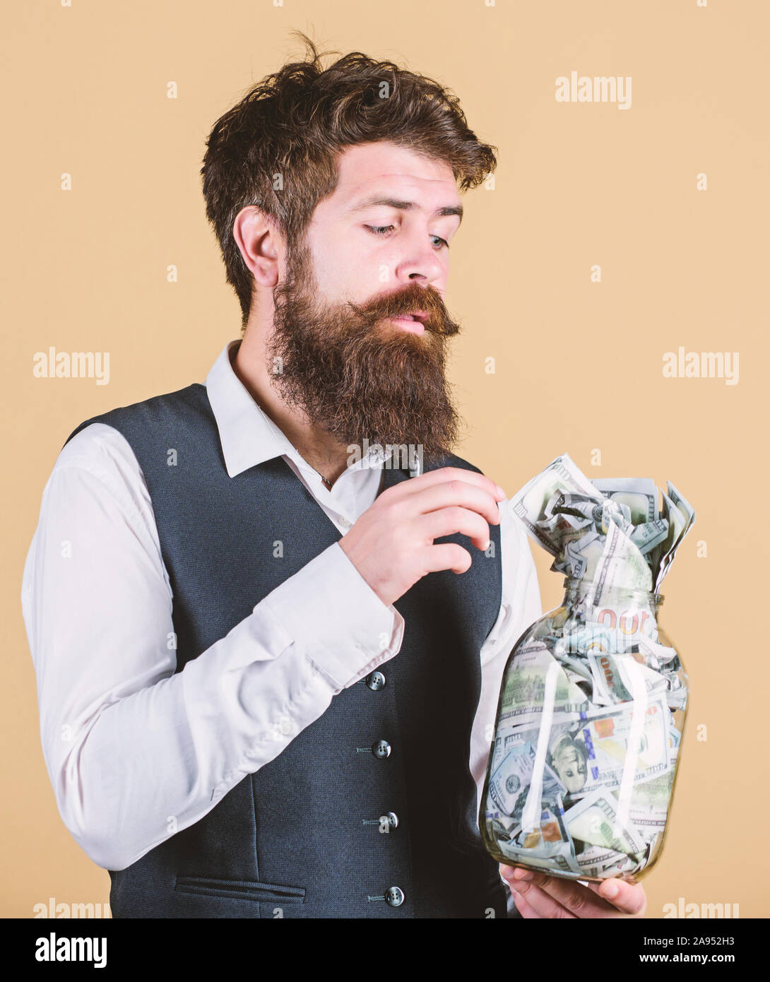 Security and cash money savings. Banking concept. Man bearded guy hold ...