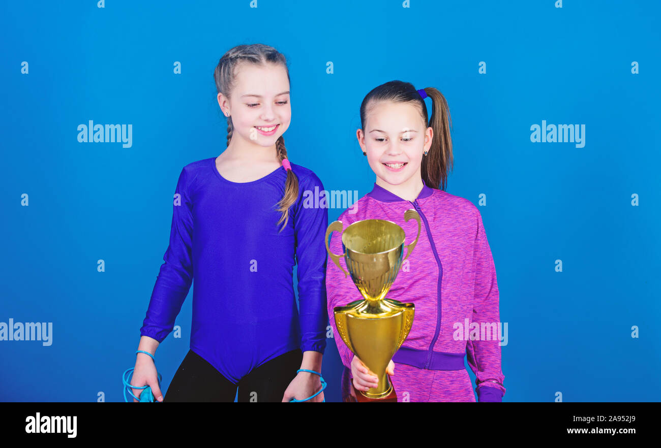victory of teen girls. Acrobatics and gymnastics. Little girls hold ...