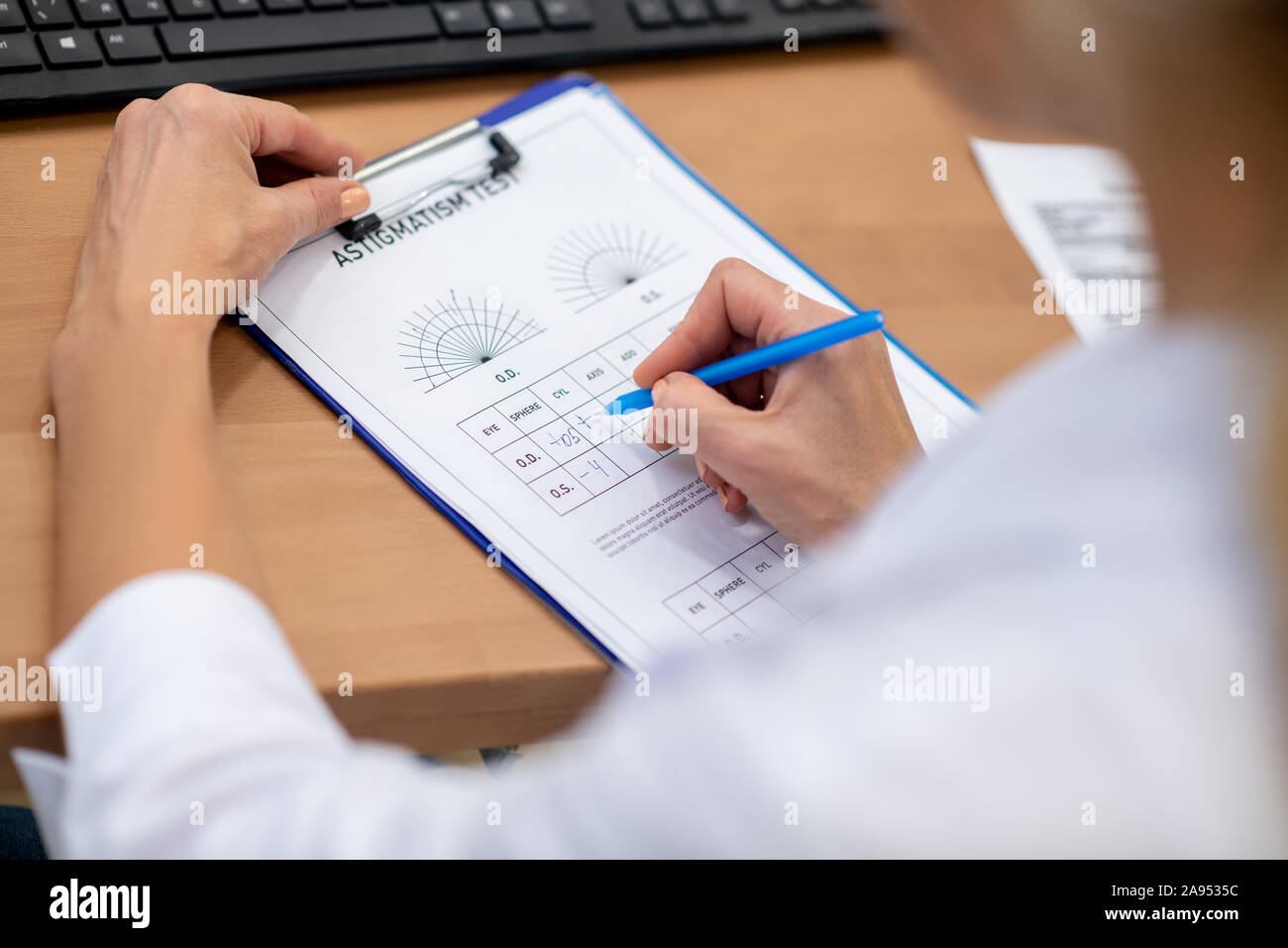 After astigmatism test. Experienced professional eye doctor making ...