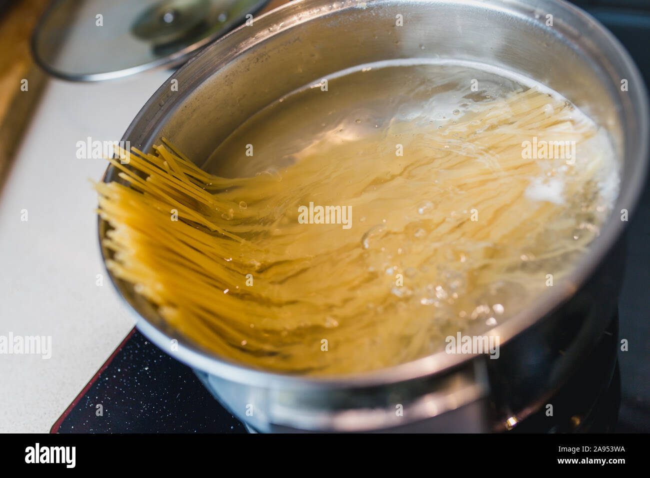Boiling water on electric induction stove cooker hi-res stock ...